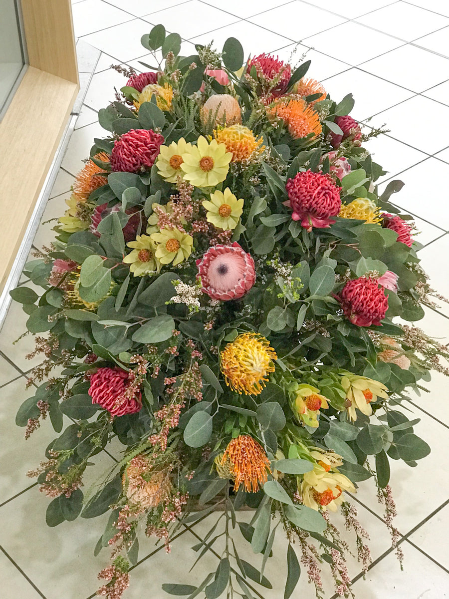 Casket Arrangement with mixed native and wildflowers – Matilda's Flowers